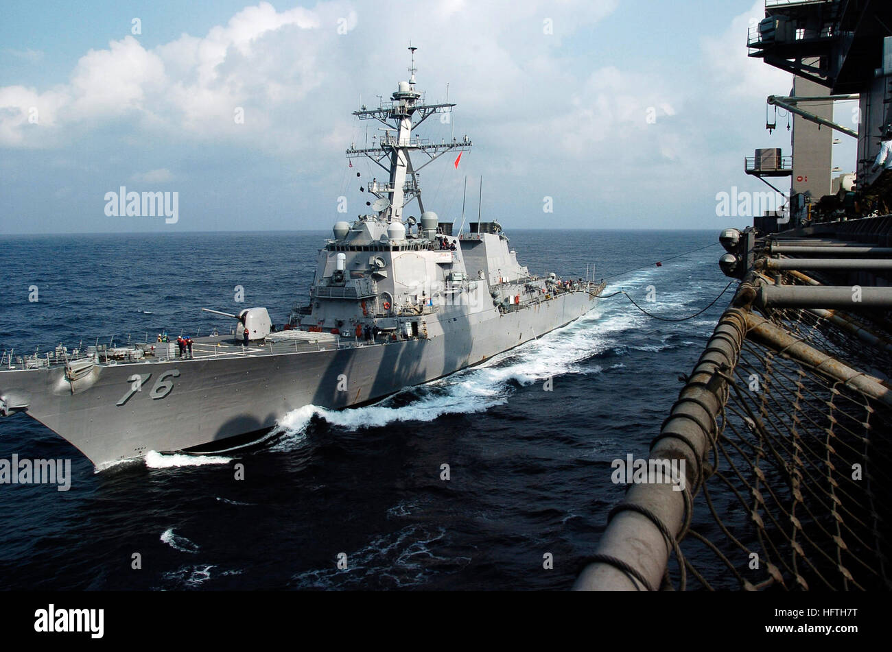 The guided-missile destroyer USS Higgins sails alongside the nuclear ...