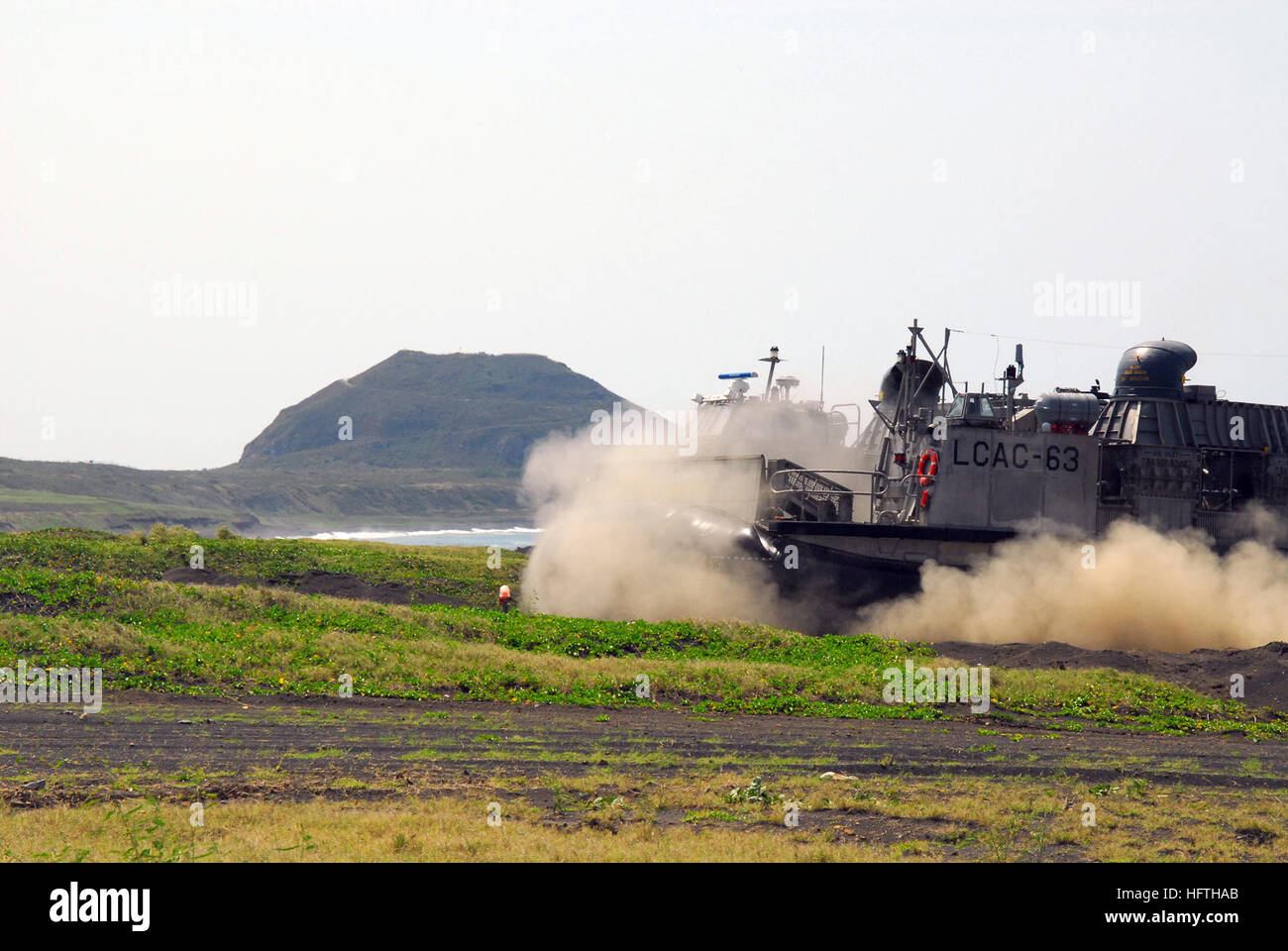 An LCAC from USS Harpers Ferry (LSD 49) lands on Iwo Jima to support ...