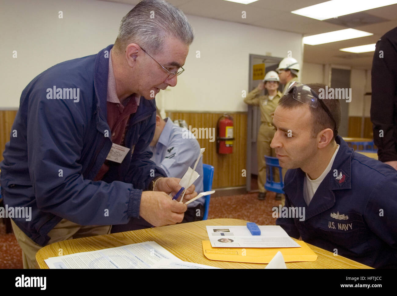 A Sailor aboard amphibious transport dock USS Nashville (LPD 13) is ...