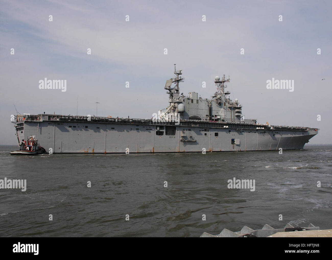 070328-N-8547M-022 Norfolk, Va. (March 28, 2007) - Tug boats assist the ...