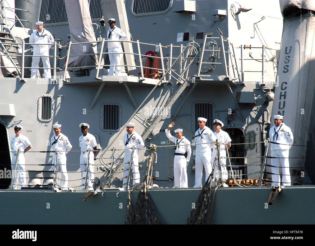 Sailors aboard USS Chung-Hoon (DDG 93), a guided missile destroyer, man ...