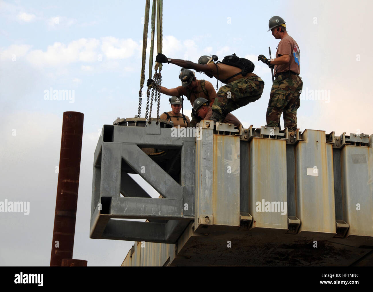 An elevated causeway support structure is installed during Joint ...