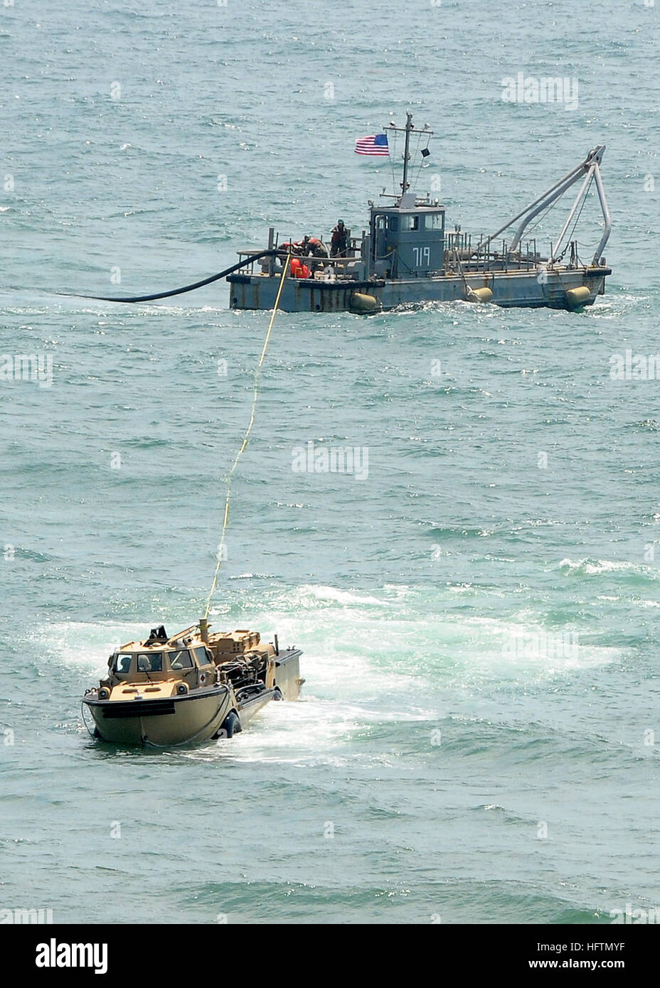 Beach Master Unit 1 personnel move offshore petroleum discharge system ...
