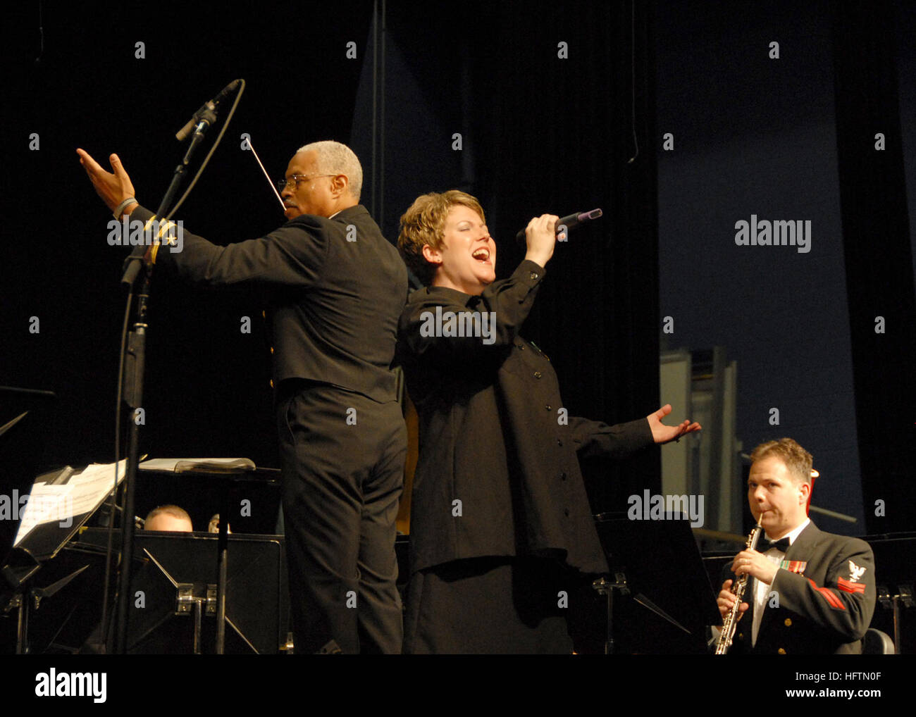 A vocal solo performance is given by a Navy musician with the U.S. Navy ...