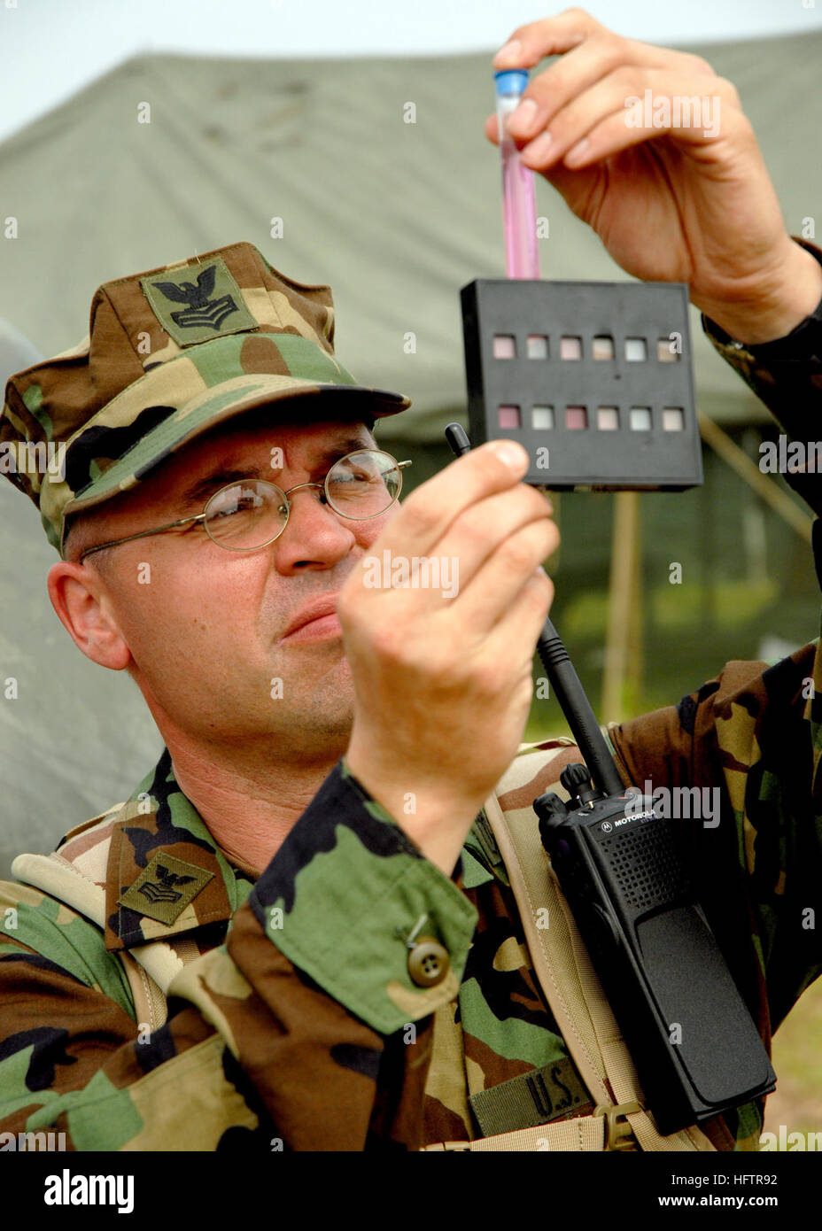 Hospital Corpsmen of Naval Mobile Construction Battalion 23 test the pH ...