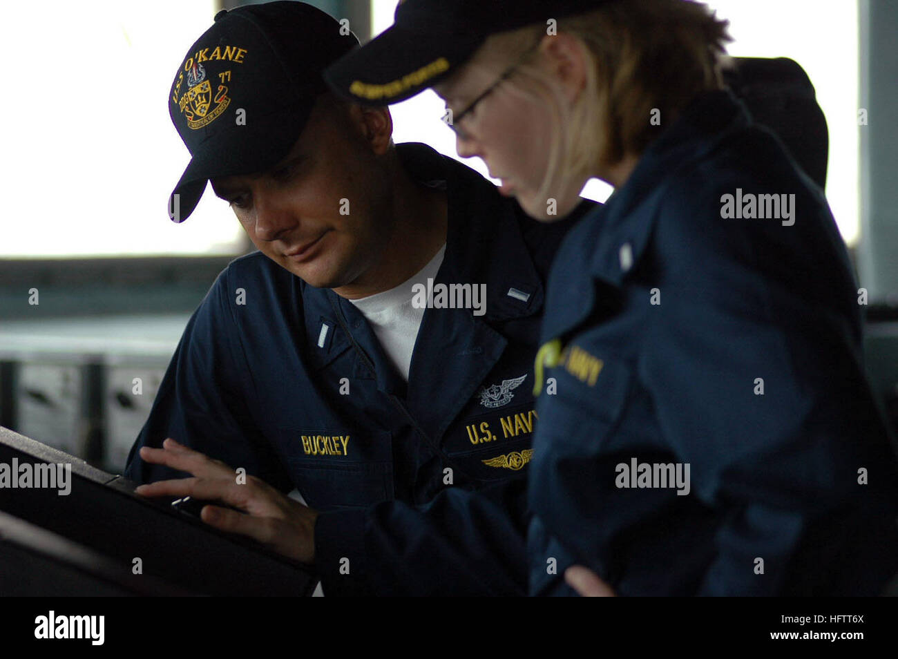 Crew aboard USS O'Kane, a guided-missile destroyer, monitors radar ...