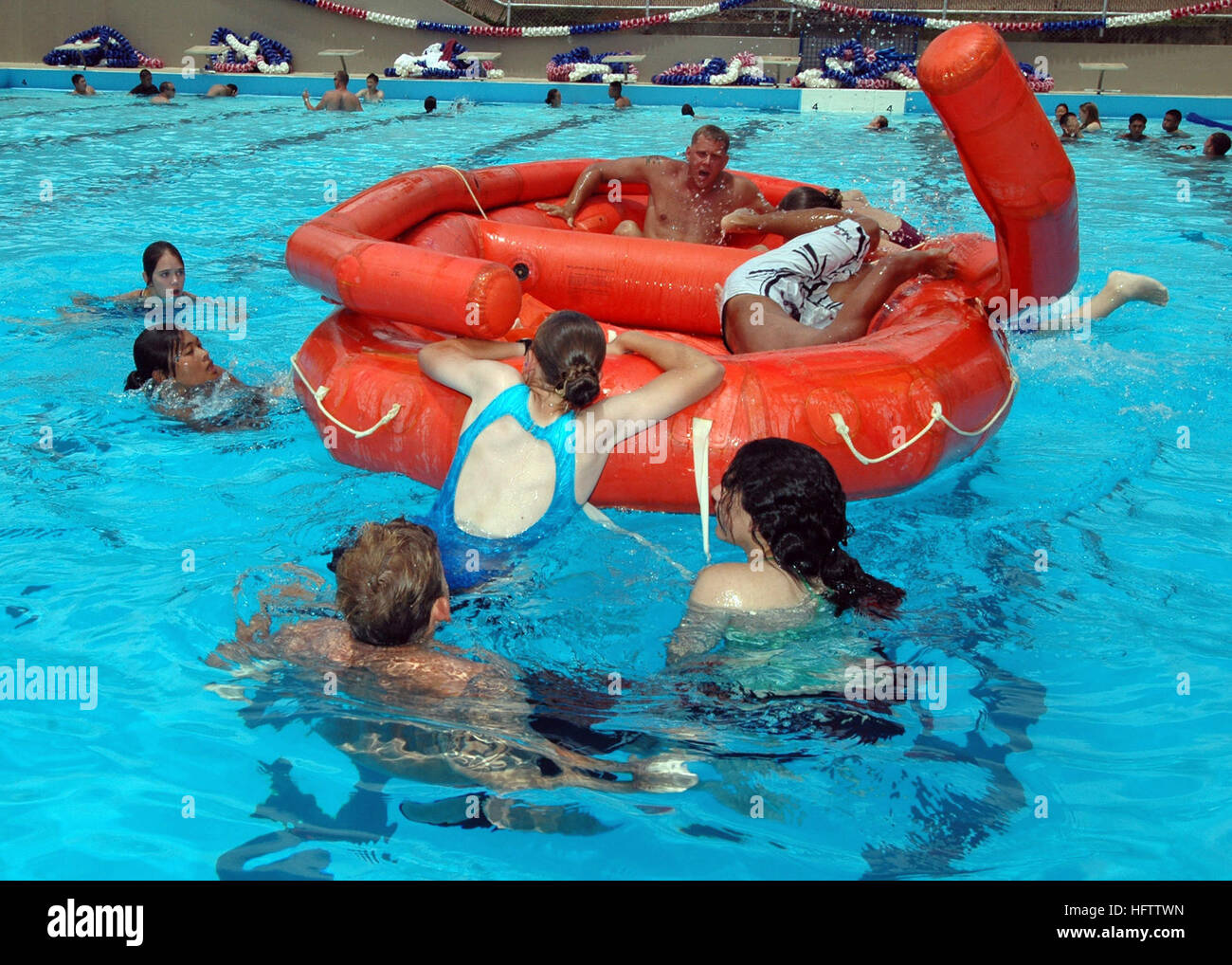 A Navy diver observes Naval Junior Reserve Officer Training Corps ...