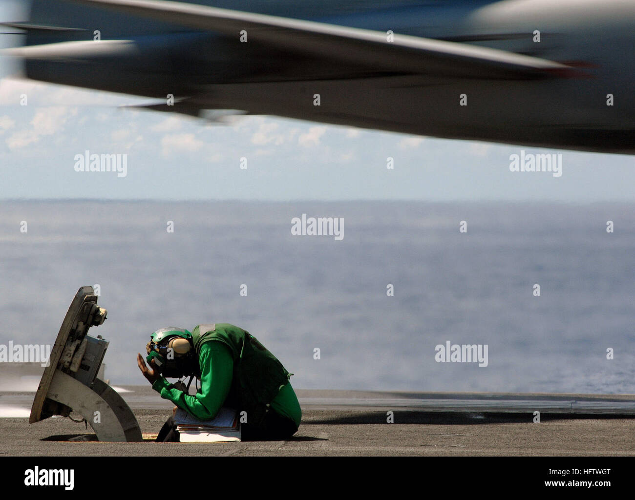 A phone talker on the flight deck of USS Harry S. Truman (CVN 75 ...