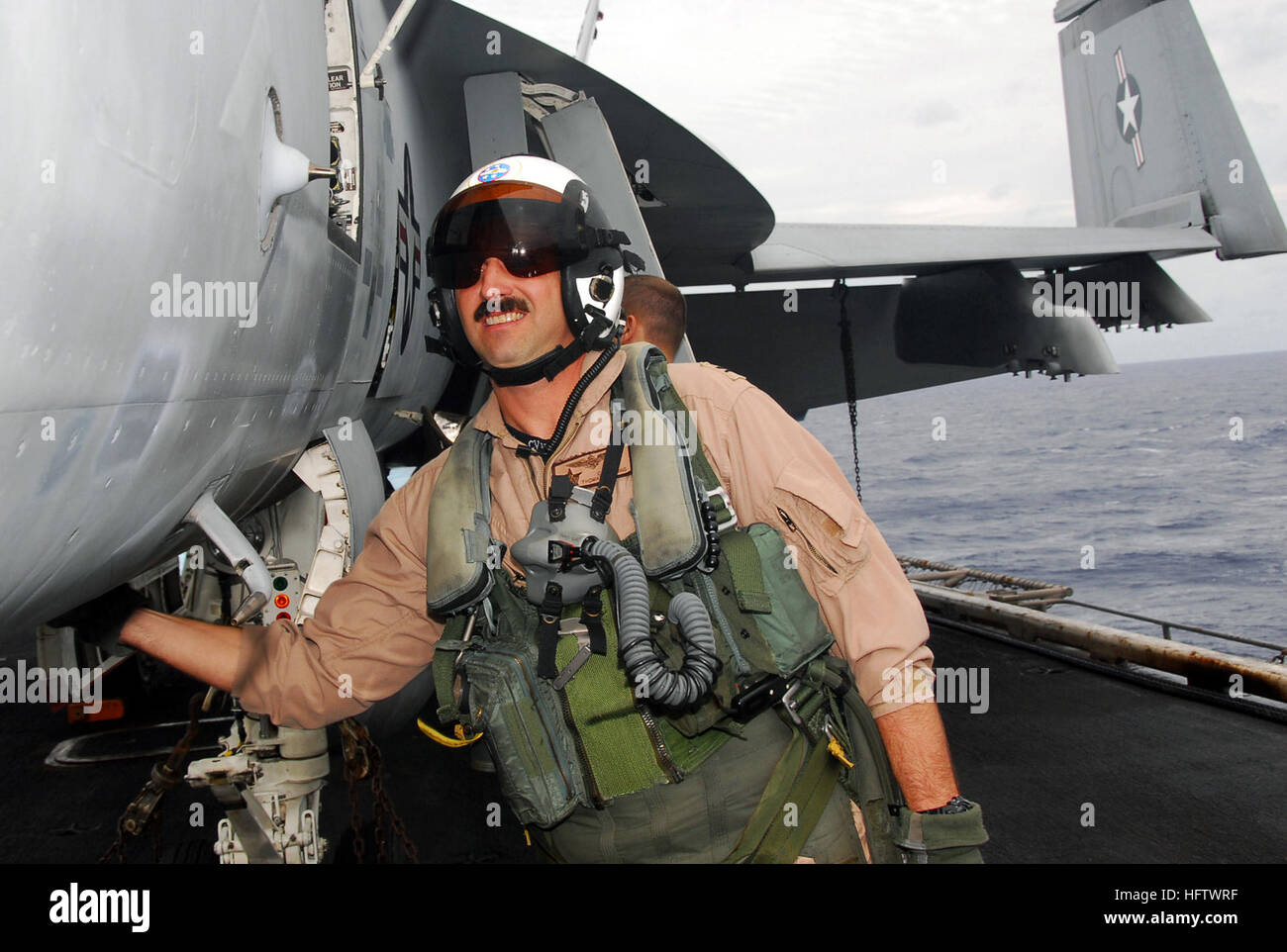 Pre-flight checks are conducted on the flight deck of nuclear-powered ...