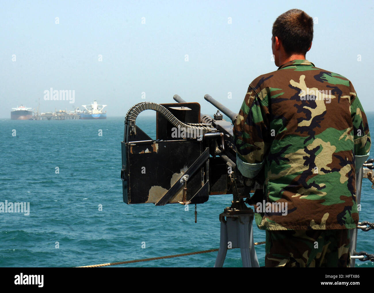 A Gunner's Mate from USS Chung-Hoon (DDG 93) stands a Small Craft ...