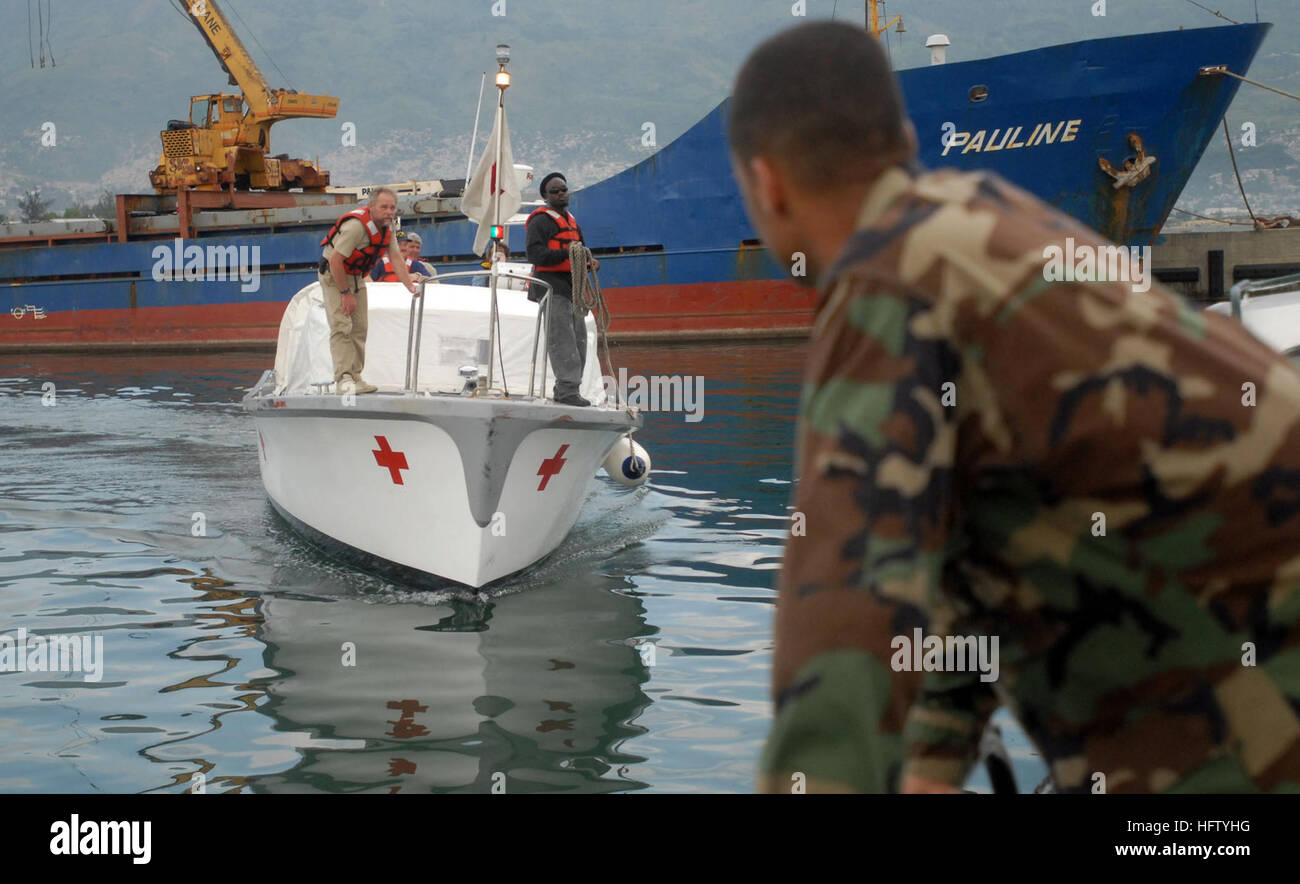 Crew members from USNS Comfort (T-AH 20) are transported by a ...
