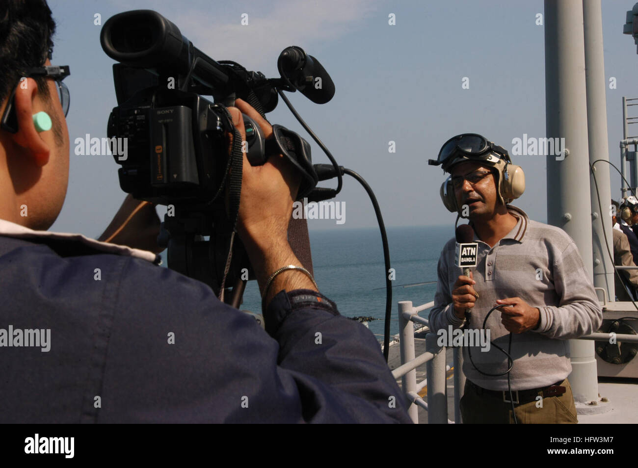 An international reporter is filmed reporting from the amphibious ...