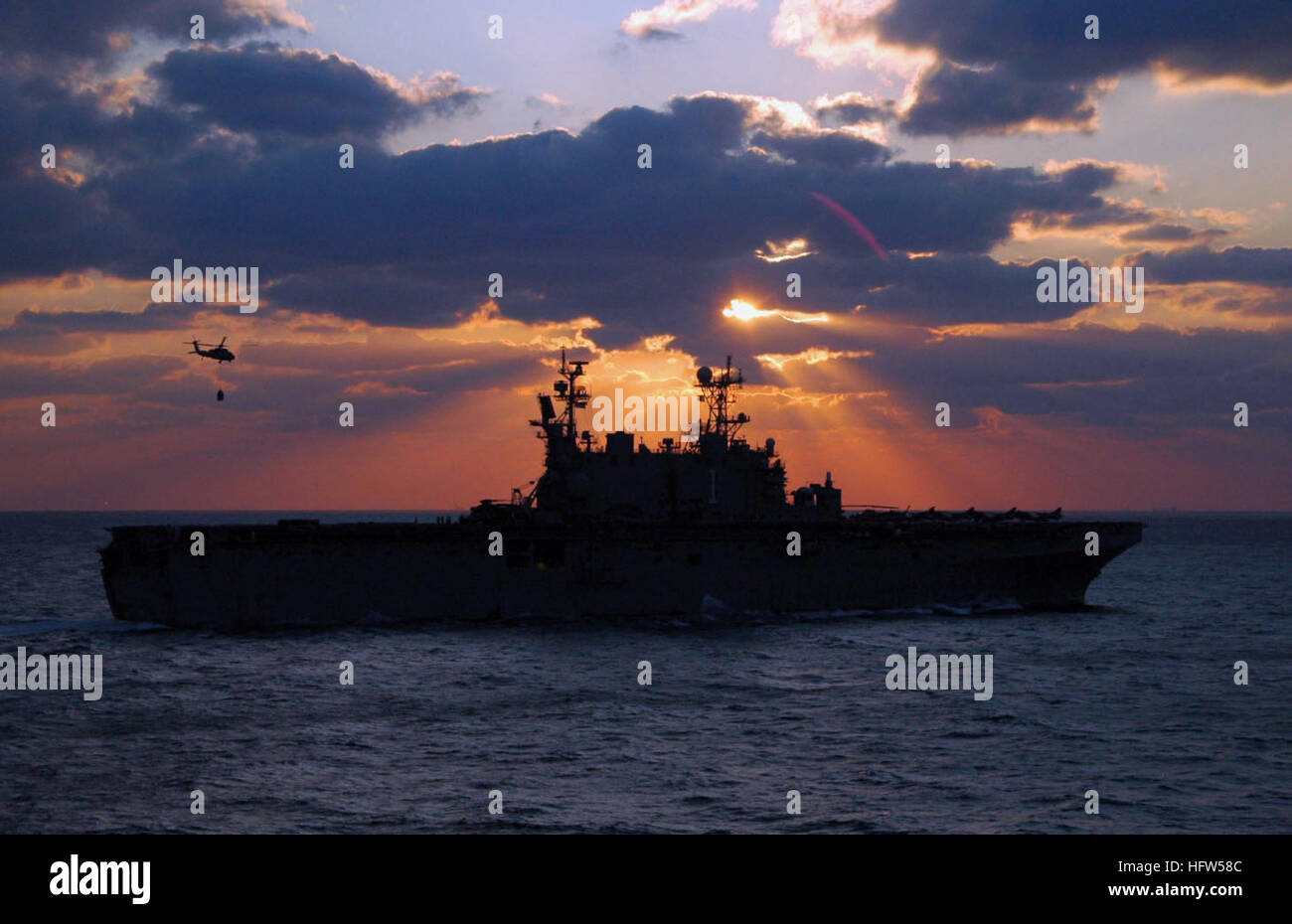 USS Tarawa (LHA 1) performs vertical replenishment operations while ...