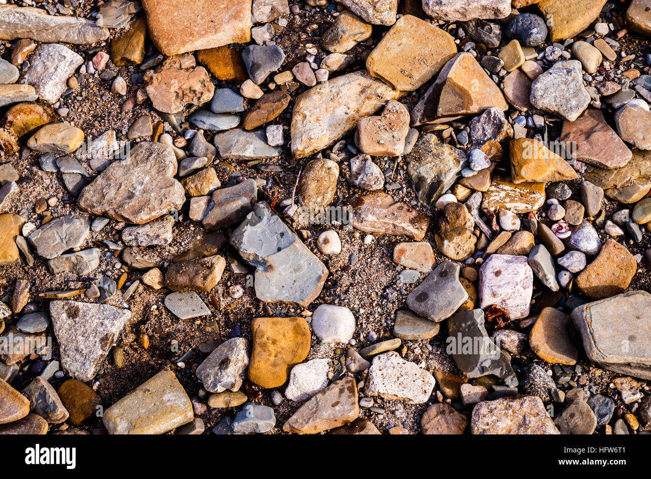 Rock stream background multicolored rocks pattern Stock Photo - Alamy