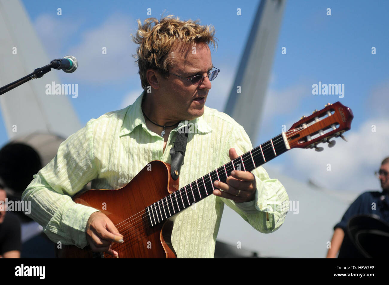 Steven Oliver, a Jazz musician, plays guitar during a live concert ...