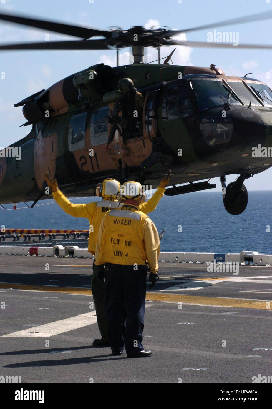 Air Department personnel use hand signals to direct an Australian S70A ...