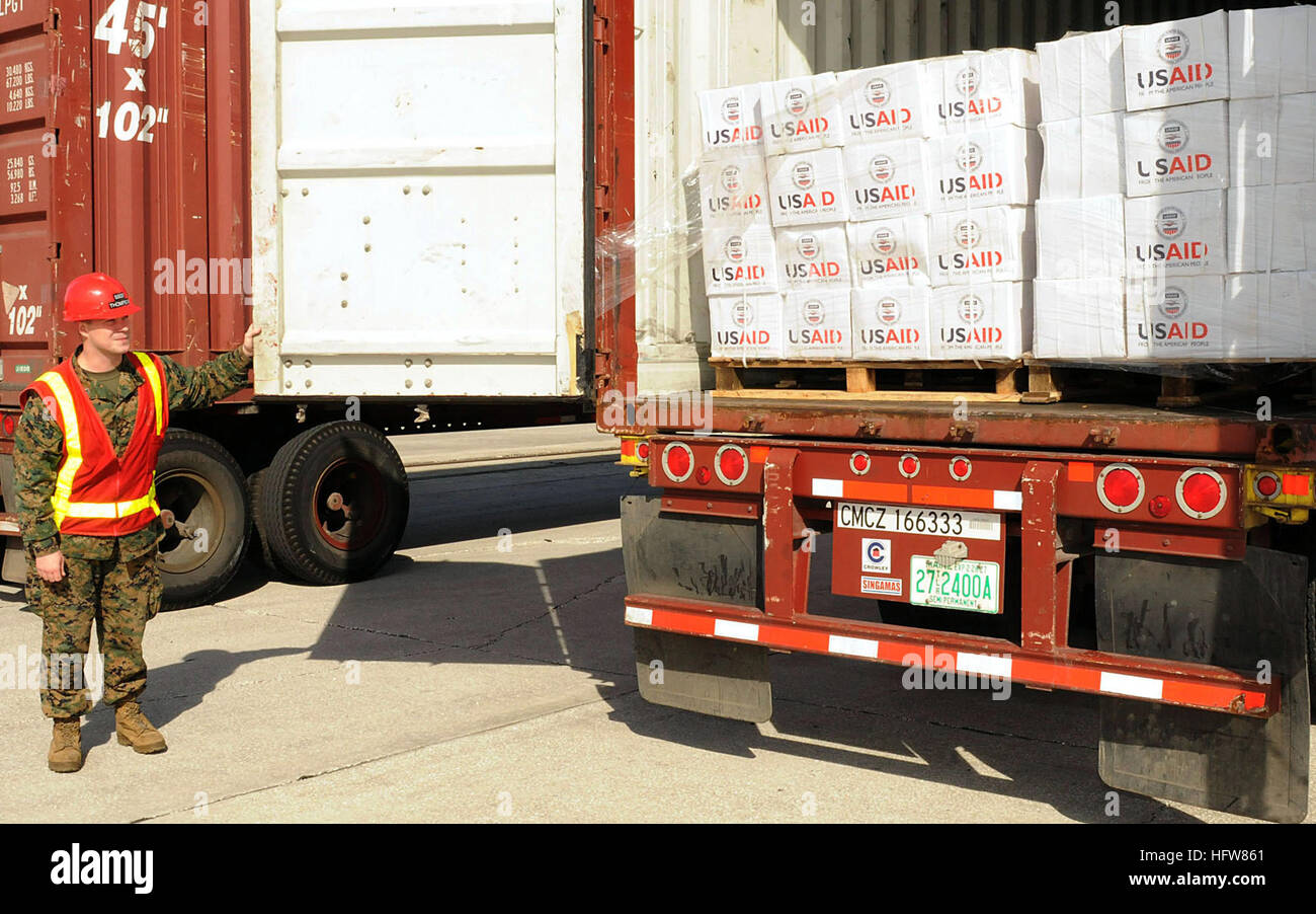 USMC inspects and loads USAID and Marine Corps cargo aboard USNS 1st Lt ...