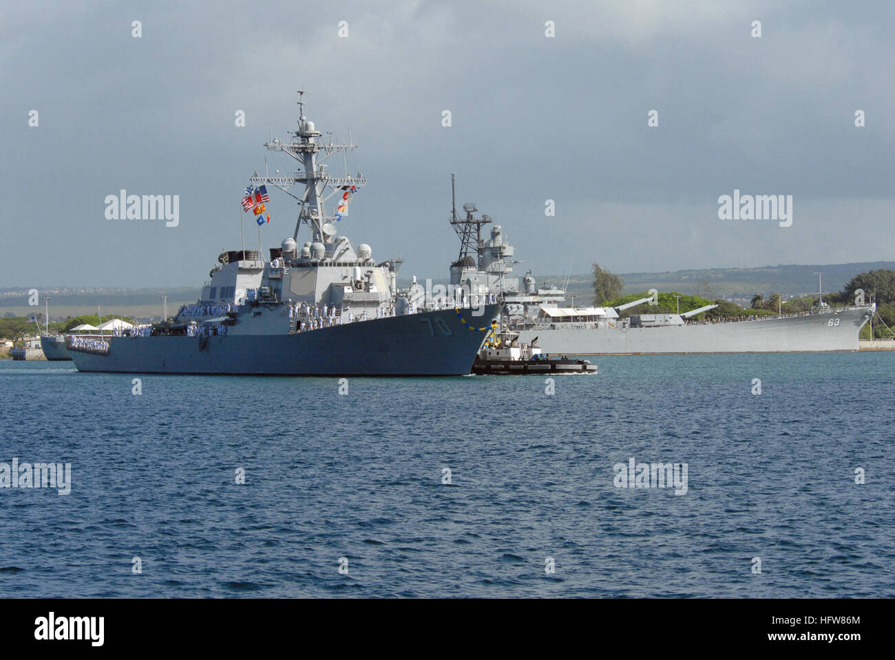 The Arleigh Burke-class guided-missile destroyer USS Hopper passes the ...