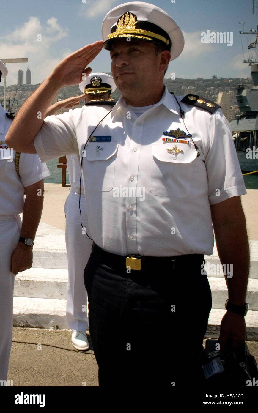 U.S. and Israeli Navy personnel render honors during a ceremony at ...