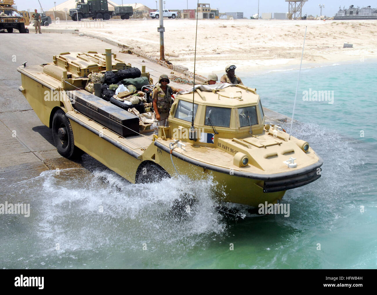 Sailors from Beach Master Unit 1 launch a lighter amphibious resupply ...