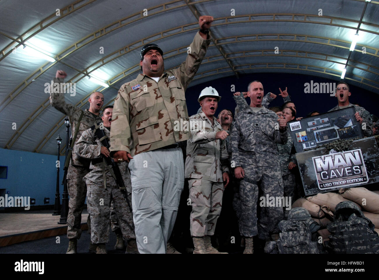 U.S. service members and volunteers transform a USO center at Camp ...