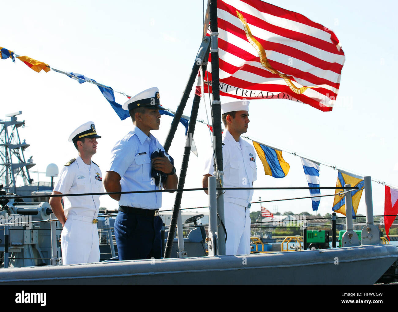 Sailors and a Coast Guardsman stand at parade rest aboard USS Monsoon (PC 4) during the Inter ...
