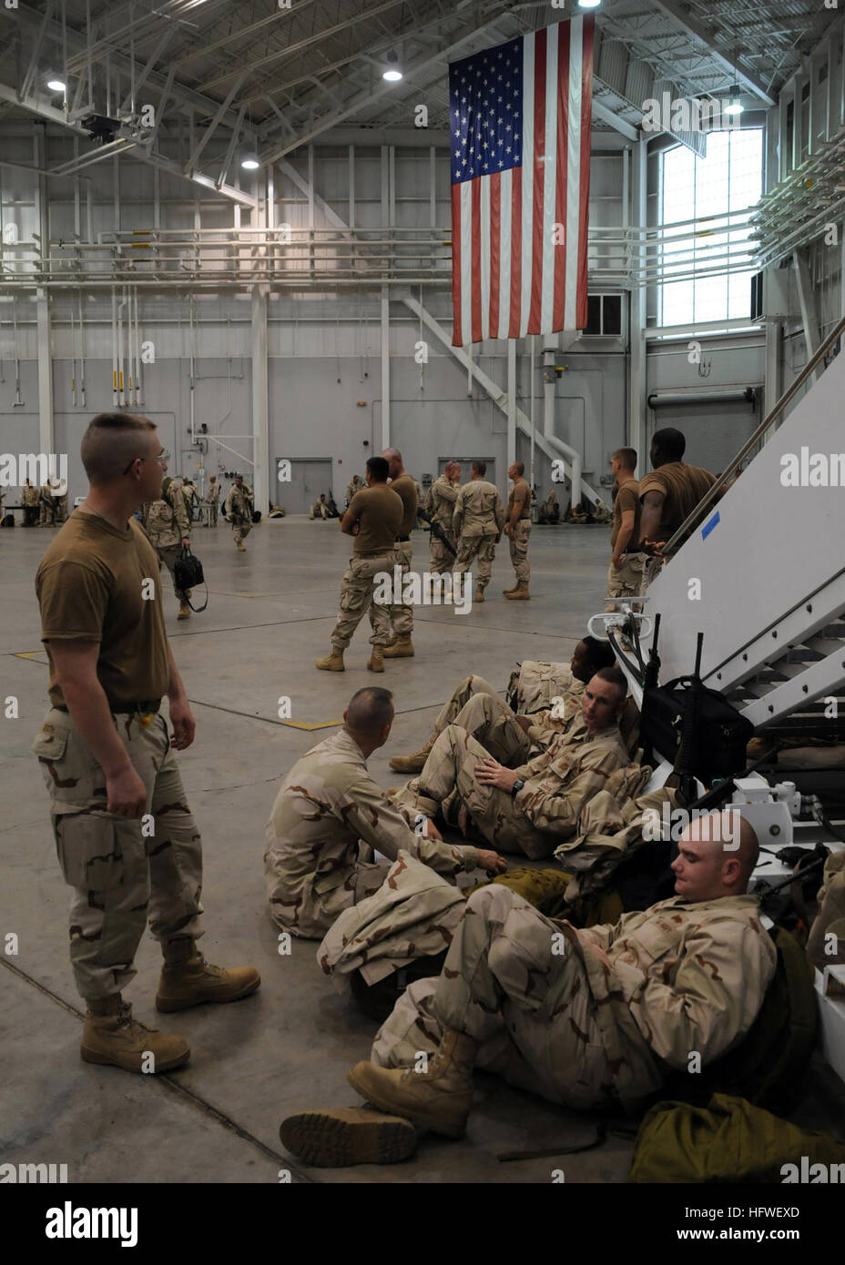 Seabees from Naval Mobile Construction Battalion 7 prepare to board ...