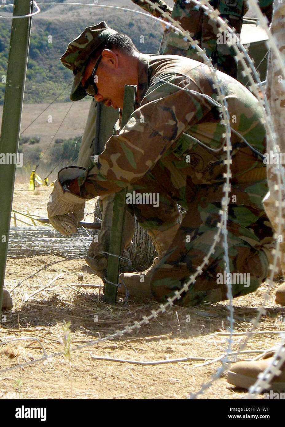 Triple strand concertina wire hi-res stock photography and images - Alamy