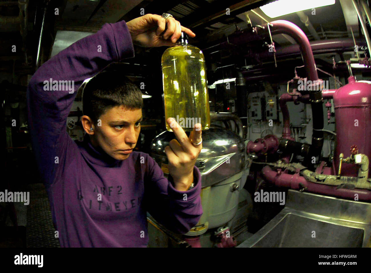 An Aviation Boatswain's Mate (Fuel) inspects JP-5 fuel aboard USS John ...