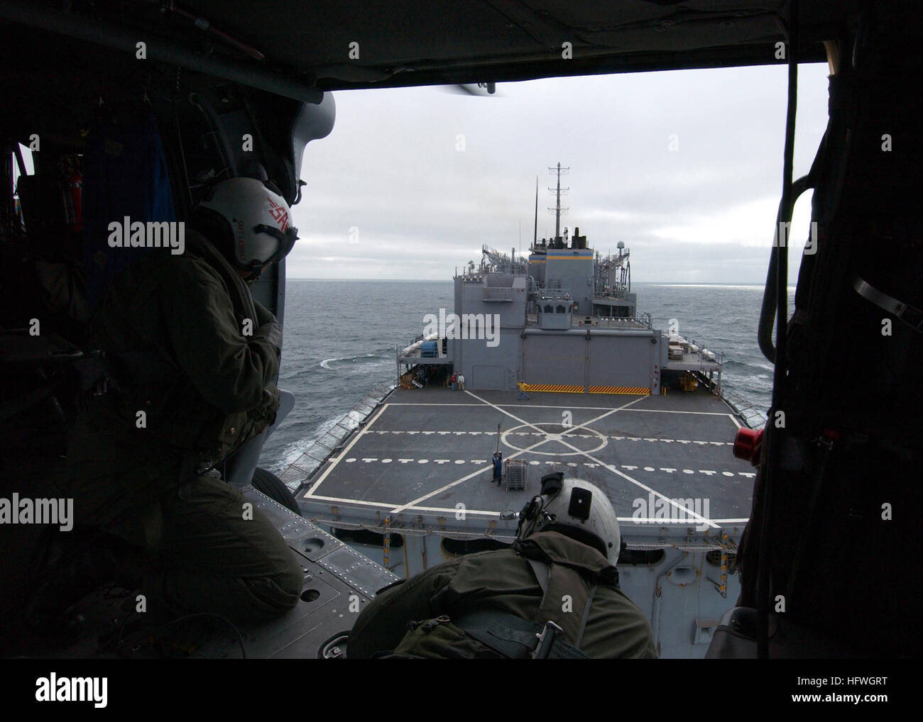 Air crewmen from Helicopter Sea Combat Squadron Three (HSC-3) monitor ...