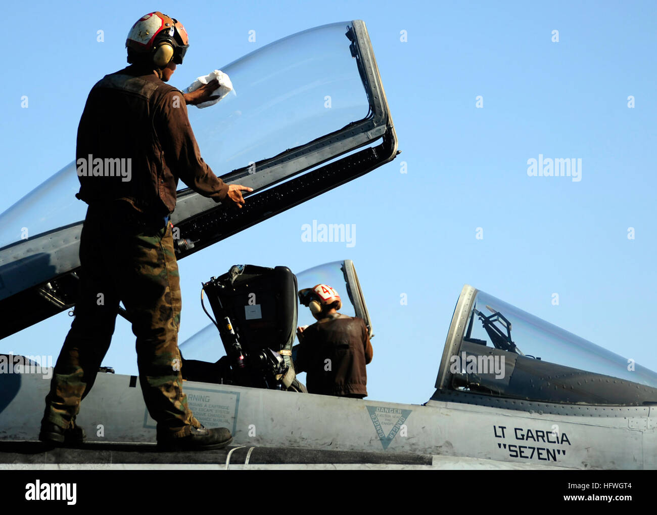 081103-N-7571S-001 GULF OF OMAN (Nov. 3, 2008) Plane captains wipe down ...