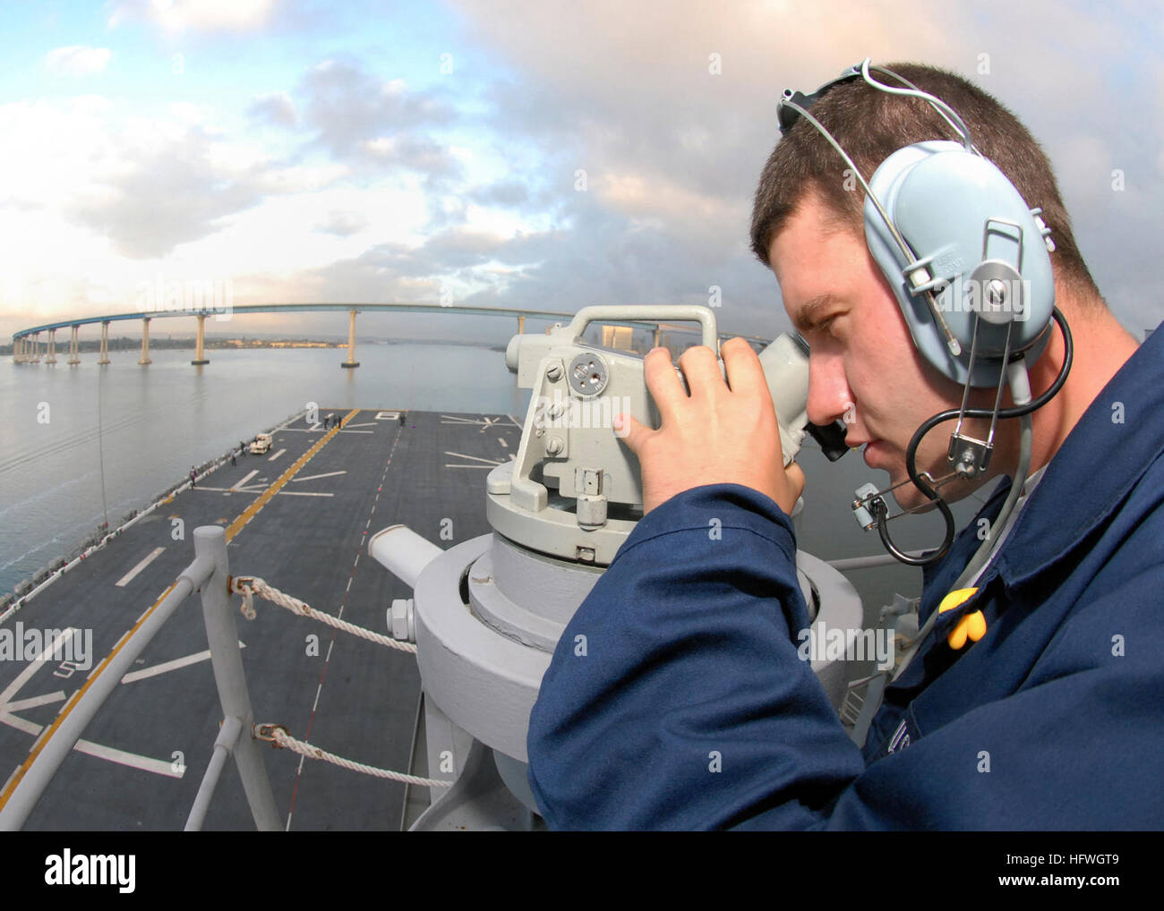 Quartermaster Seaman Tom Vest uses an alidade navigation device to ...