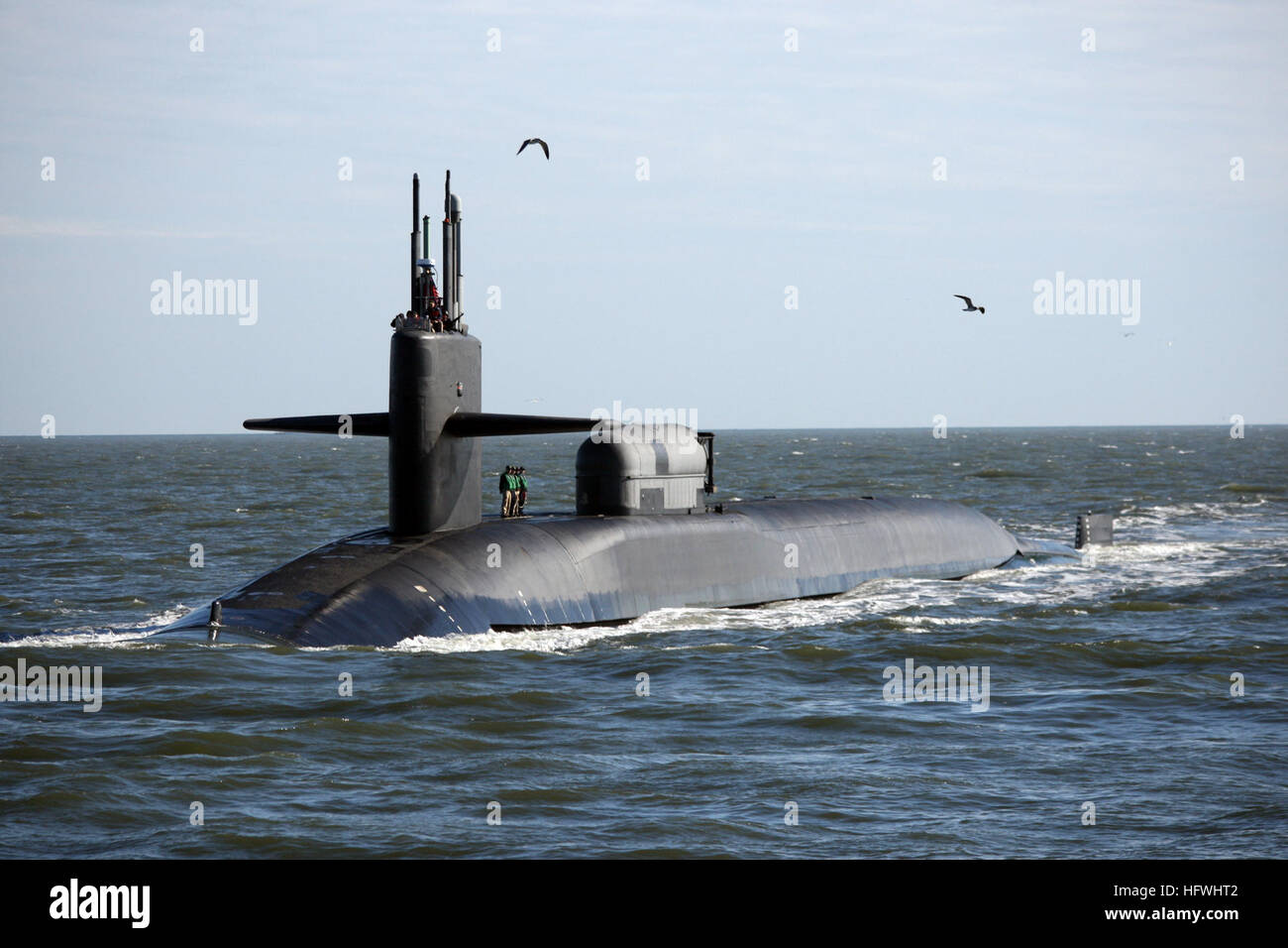 U.S. Sailors man a topside watch onboard the U.S. Navy guided missile ...