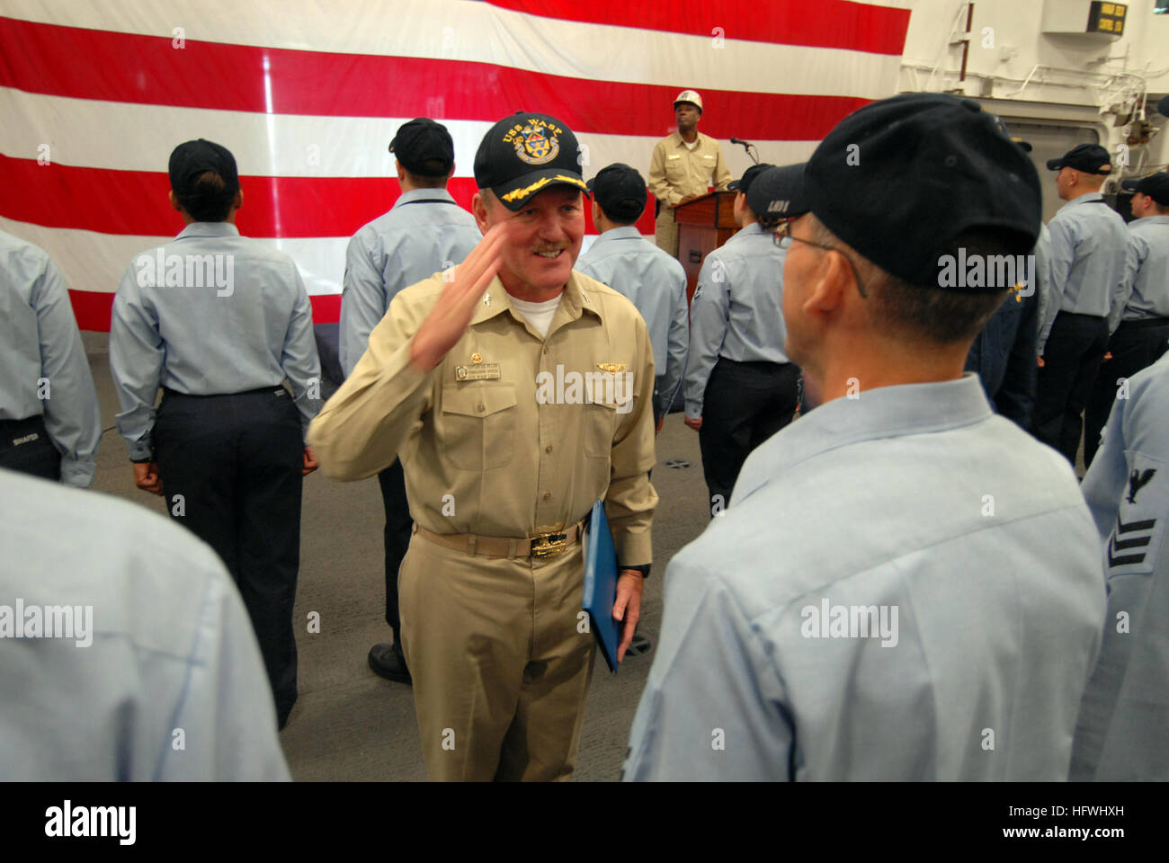 The commanding officer of USS Wasp salutes a newly frocked 1st class ...