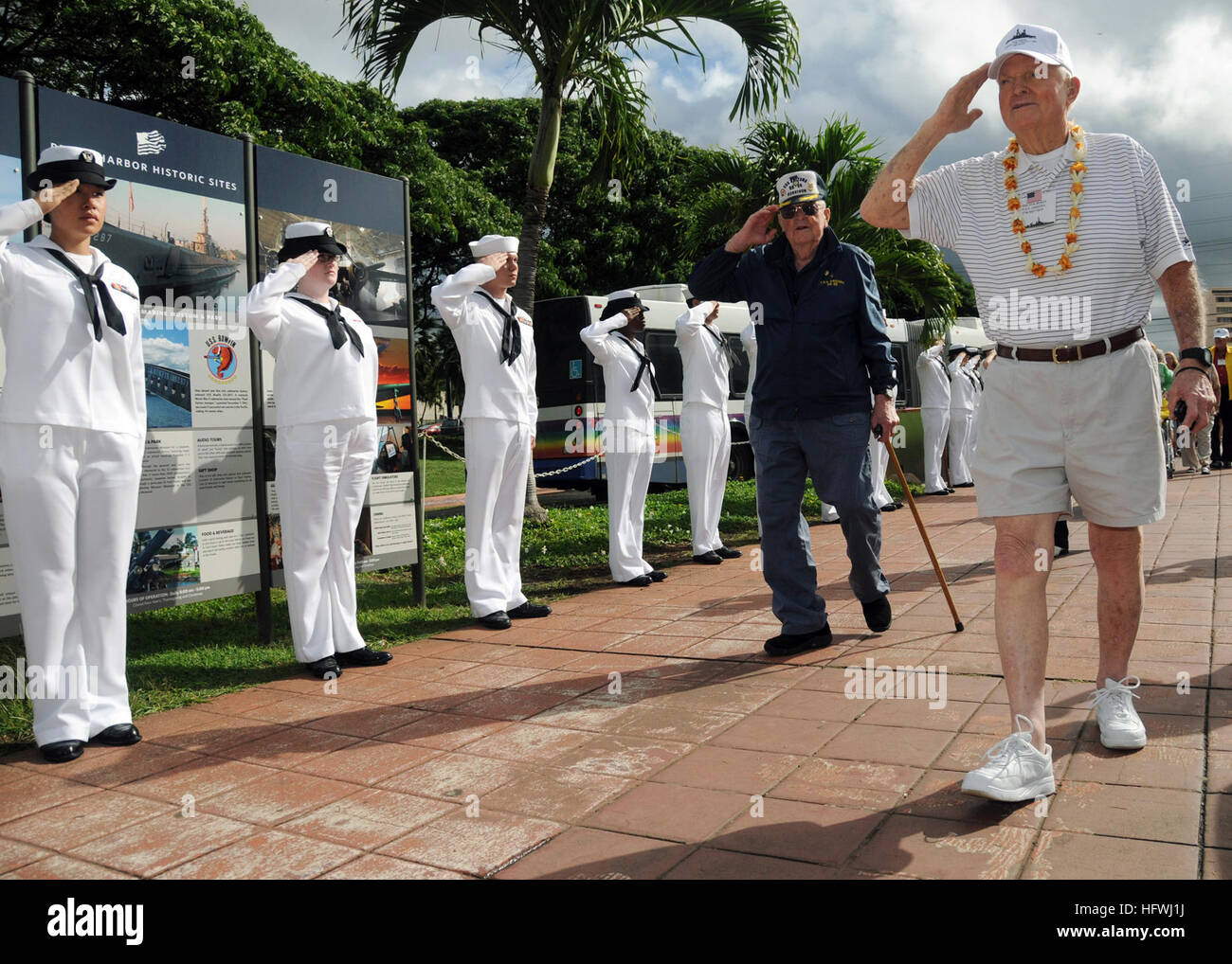 Survivors of battleship USS Arizona salute a cordon of Sailors and ...