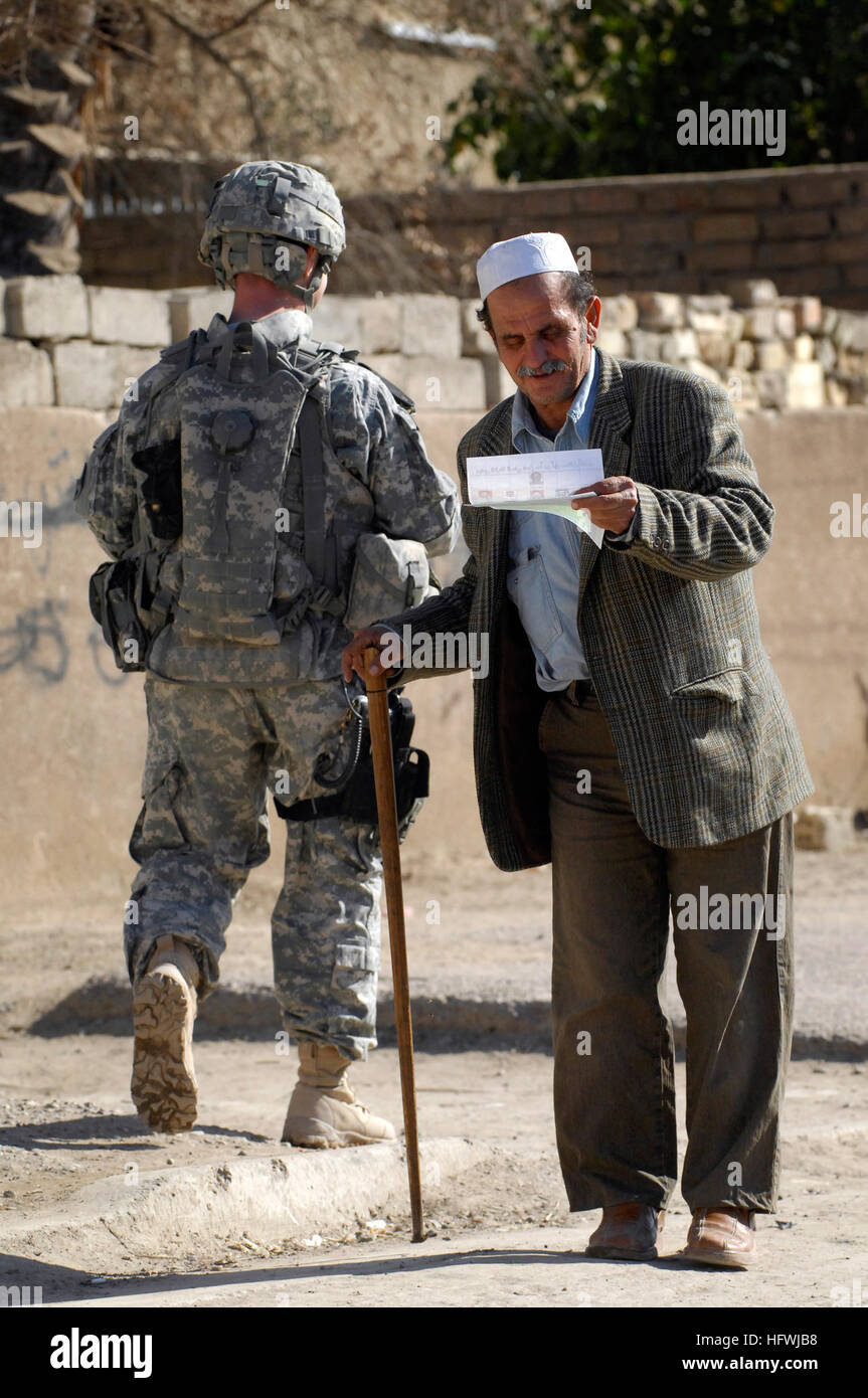 081206-N-1810F-102 BAHGDAD, Iraq (Dec. 6, 2008) An Iraqi man pauses to ...
