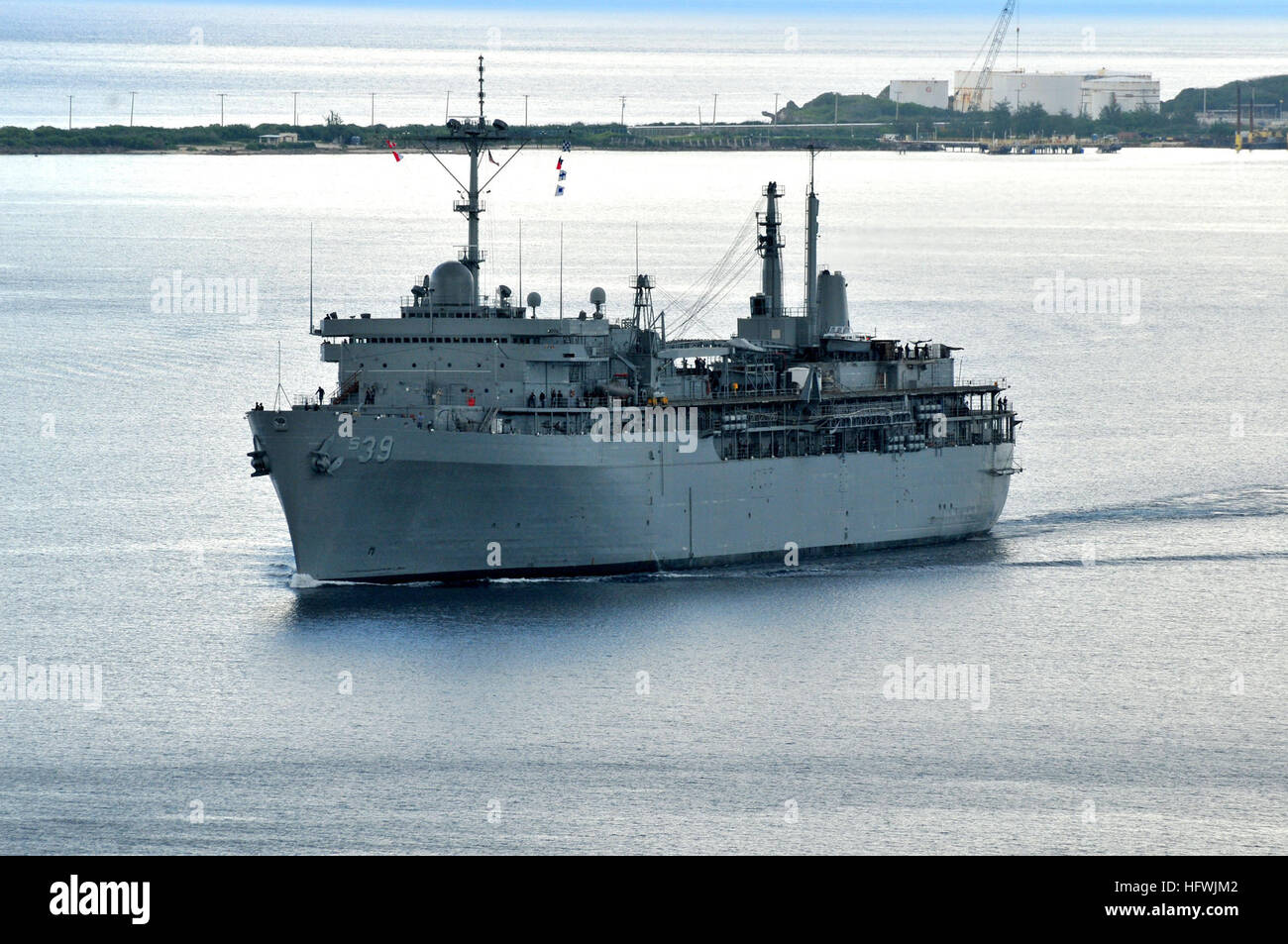 The submarine tender USS Emory S. Land transits Apra Harbor after a ...