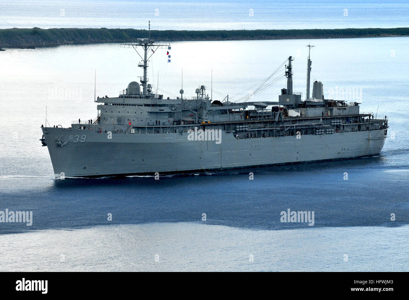 Submarine tender USS Emory S. Land (AS 39) transits Apra Harbor after a ...