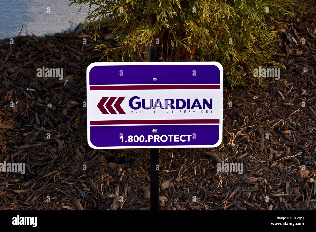 A Guardian protection sign displayed in the front of a residential home ...