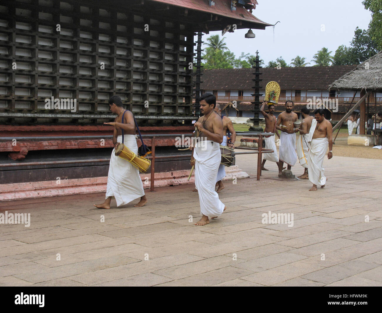 Holy people performing daily worship rituals in Shri Krishna temple ...