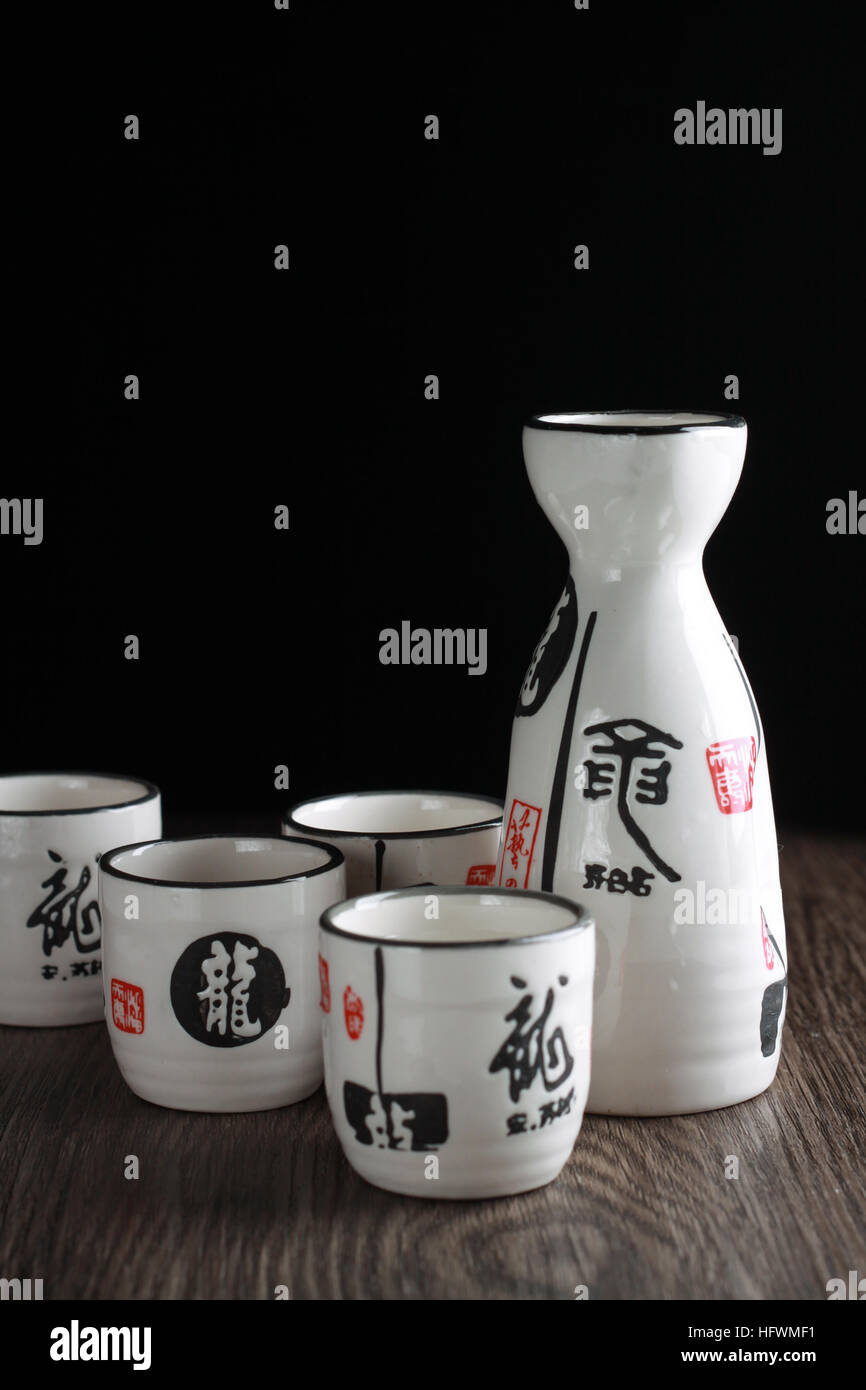 japan sake ceramic bottle and cup with black background shoot in the ...