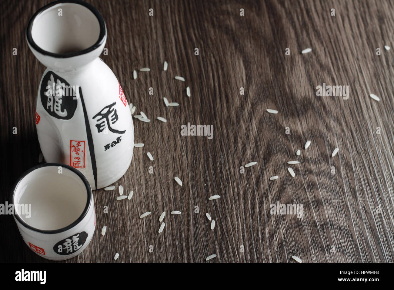 japan sake ceramic bottle and cup with black background shoot in the ...