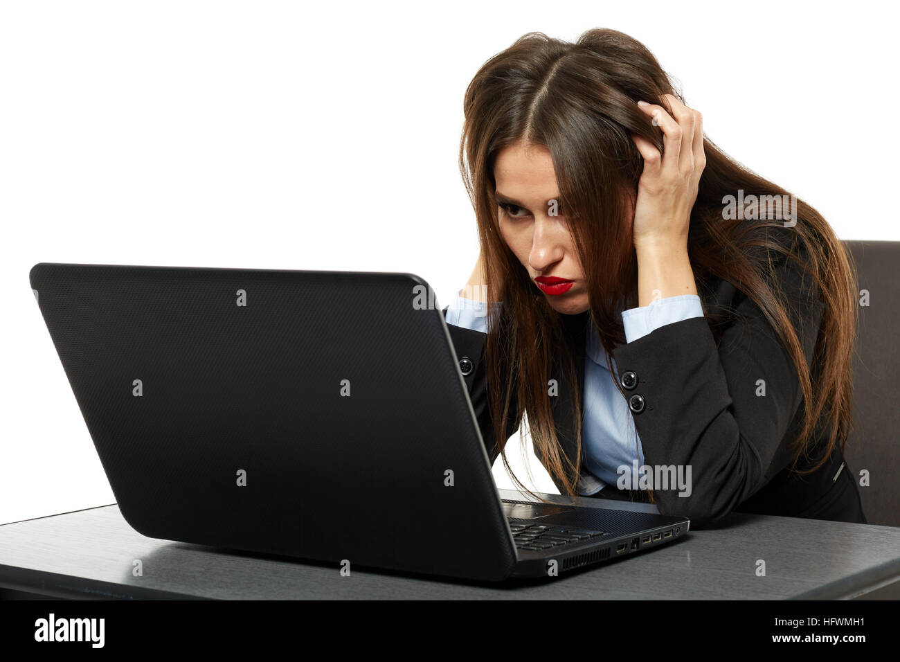 Frustrated and extremely angry business woman at her laptop Stock Photo ...