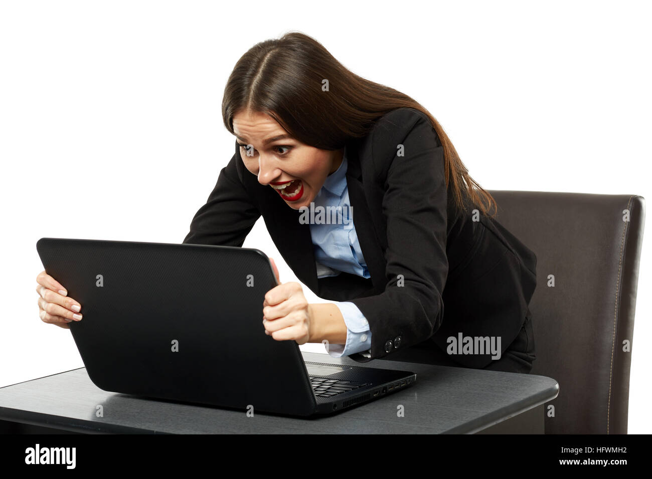 Frustrated and extremely angry business woman at her laptop Stock Photo ...
