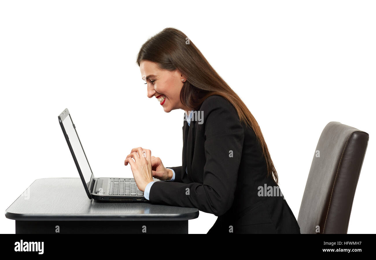 Amused business woman laughing at what she was reading on her laptop ...