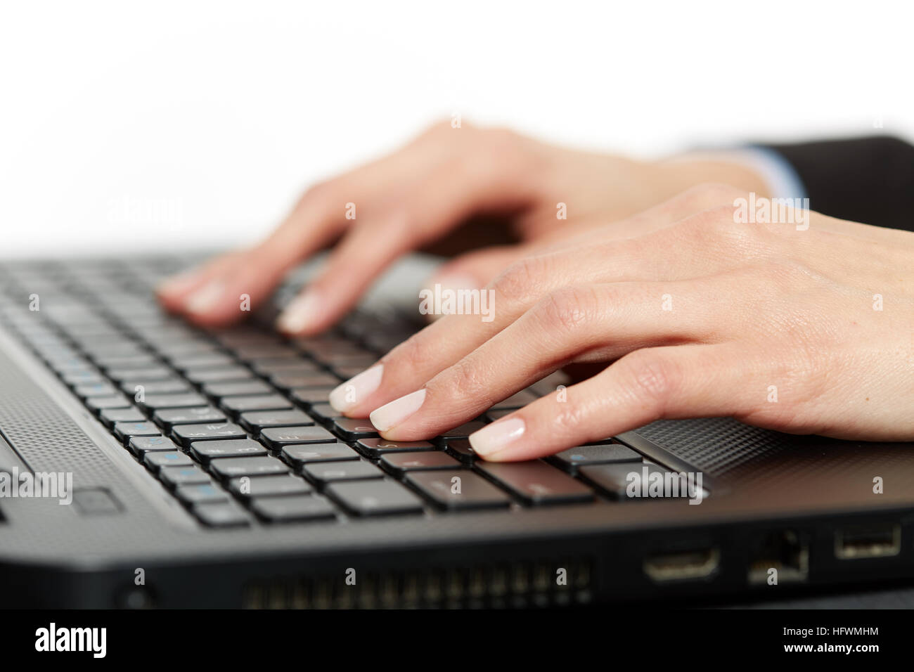 Closeup of woman's hands over laptop keyboard, typing Stock Photo - Alamy