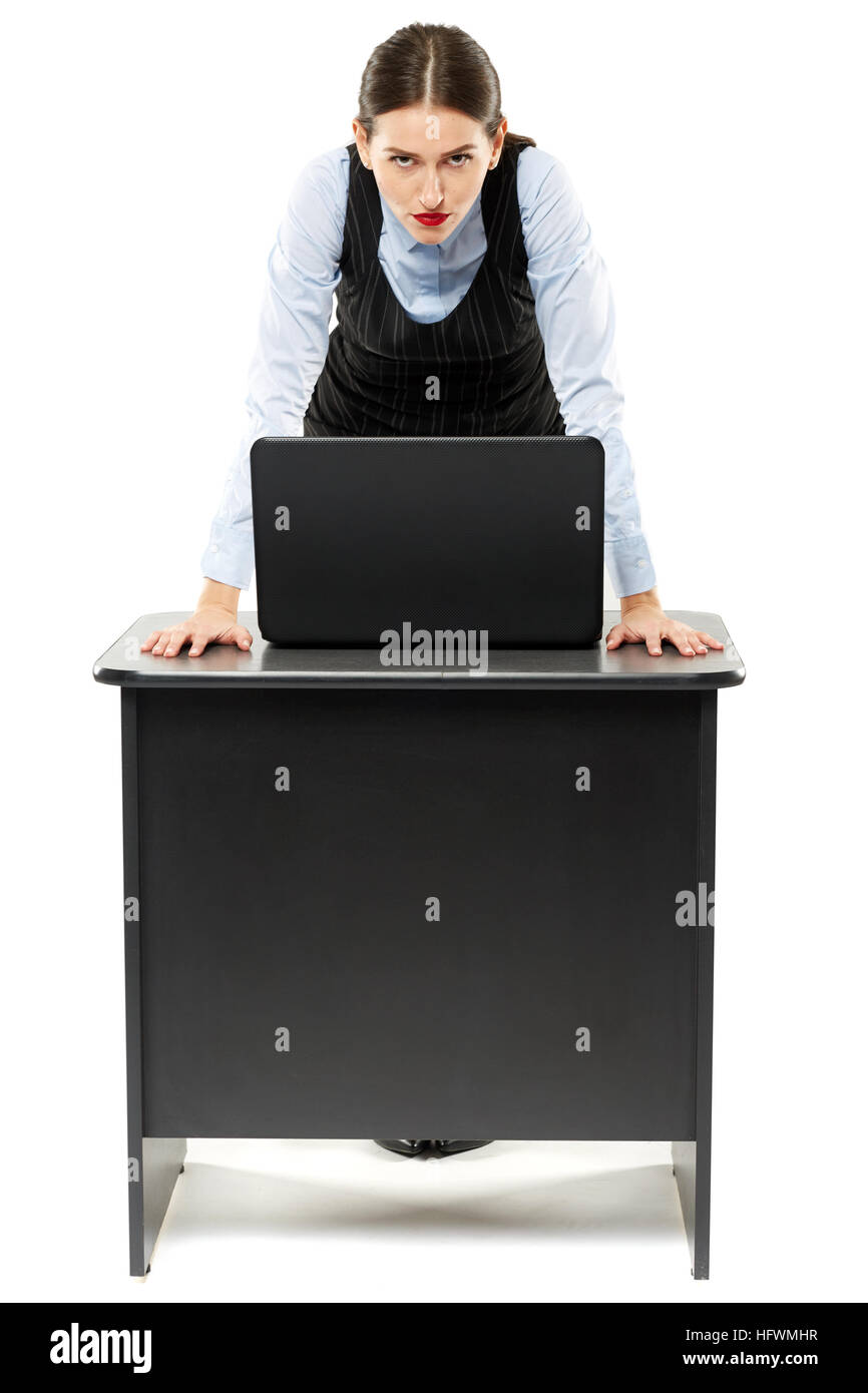 Aggressive young businesswoman standing near her desk Stock Photo - Alamy