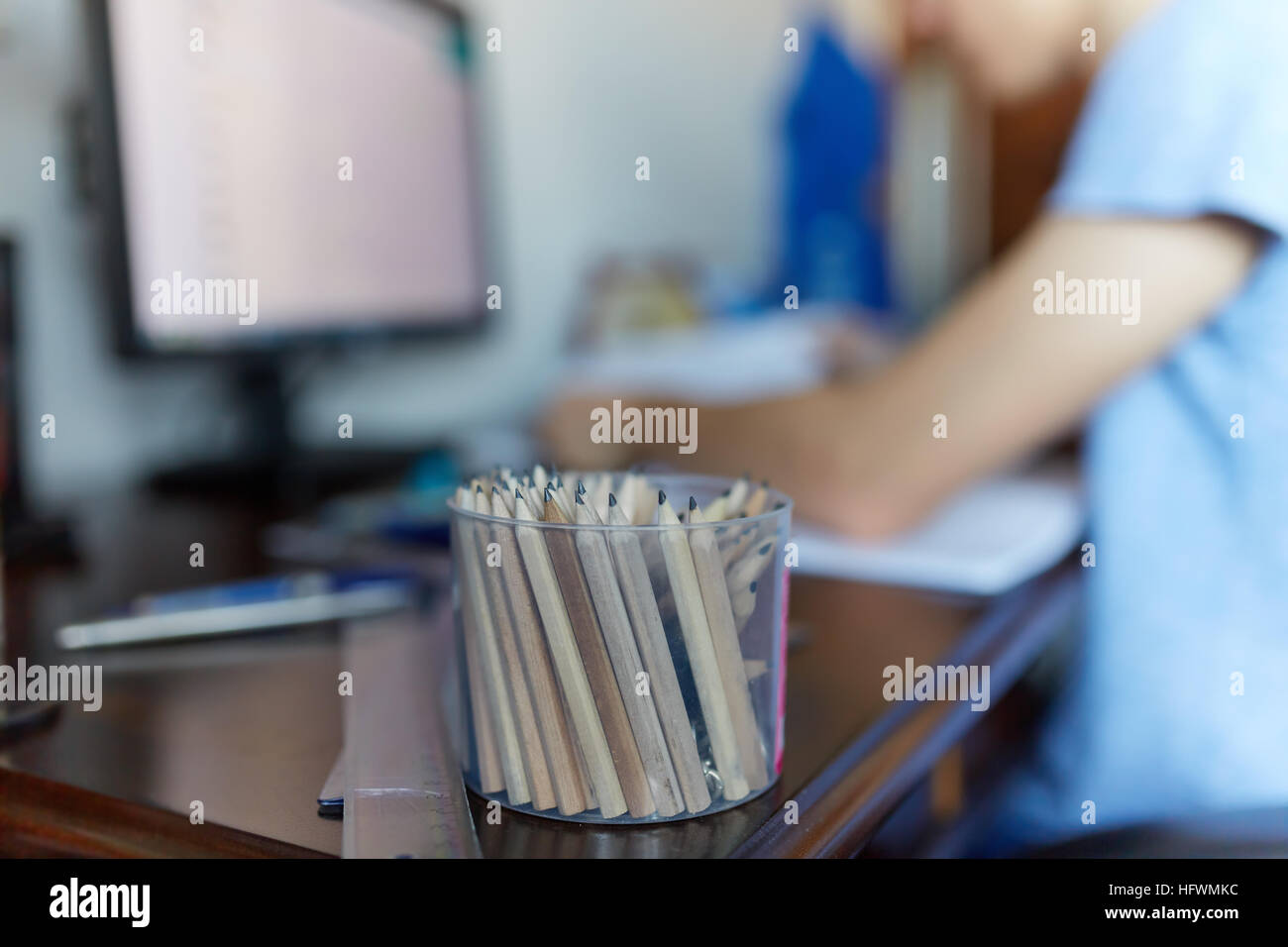 Teenager boy doing homework on his desk at home Stock Photo - Alamy