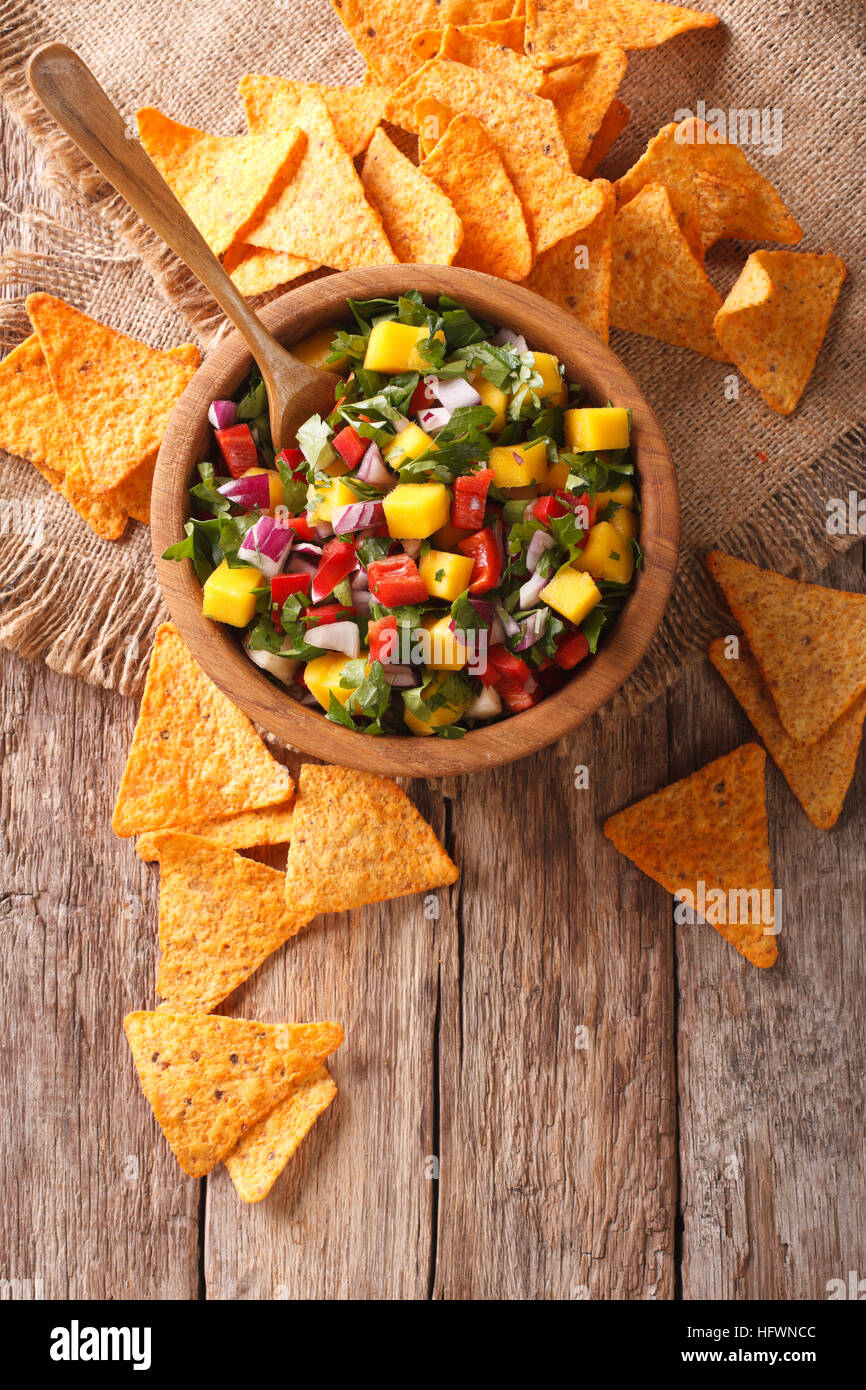 Delicious salsa with mango, chilli pepper, cilantro and onion close up ...