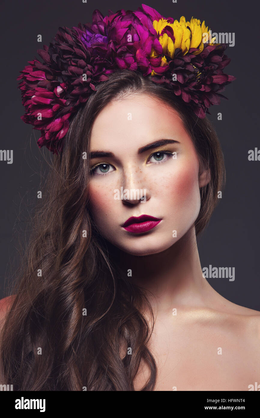 Beautiful girl with flowers on head Stock Photo - Alamy